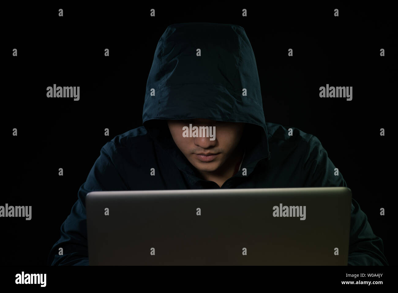hacker and laptop meaning safety data Stock Photo - Alamy