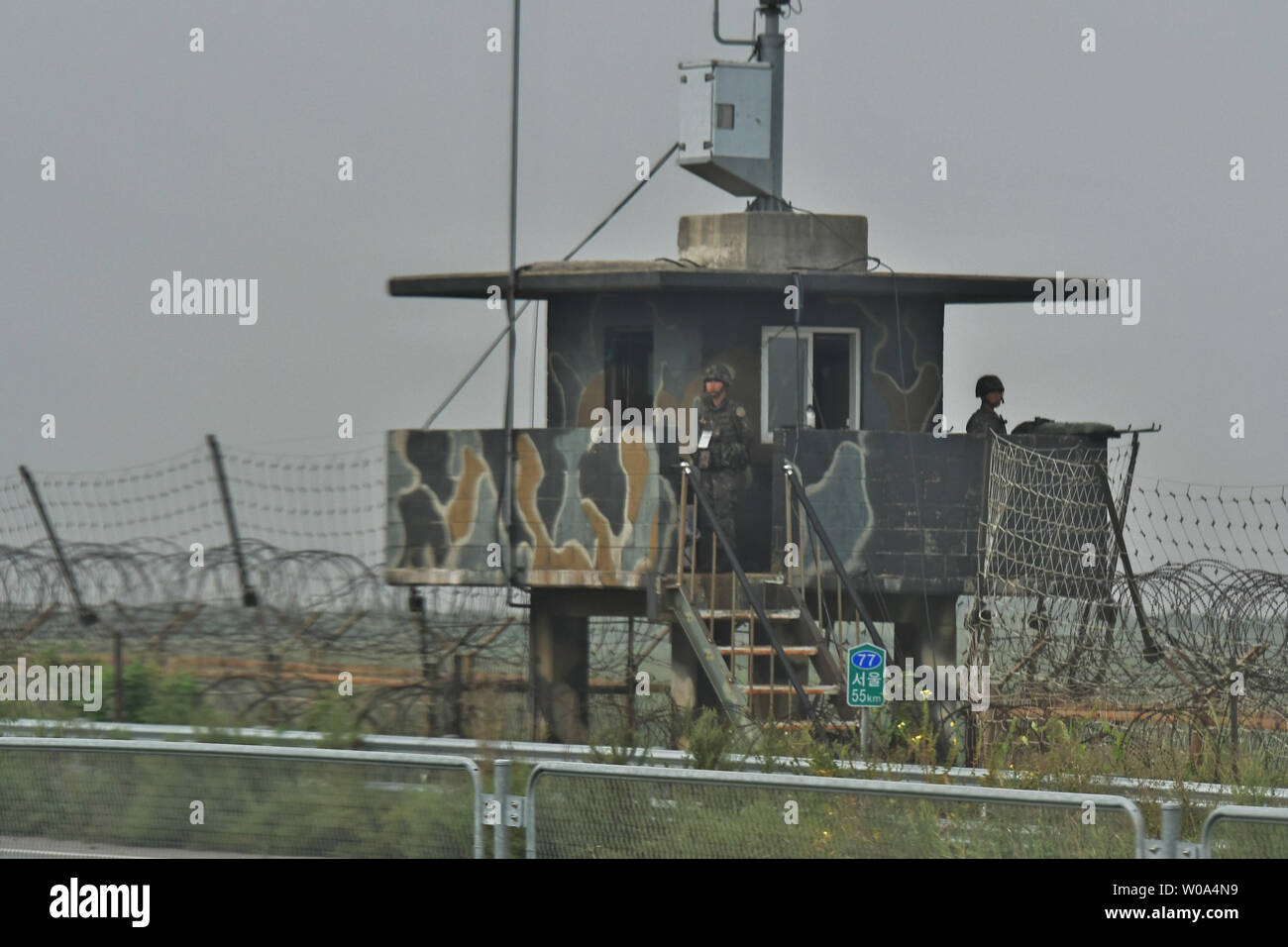 South Korean soldiers observe on watch-towers near the Demilitarized ...