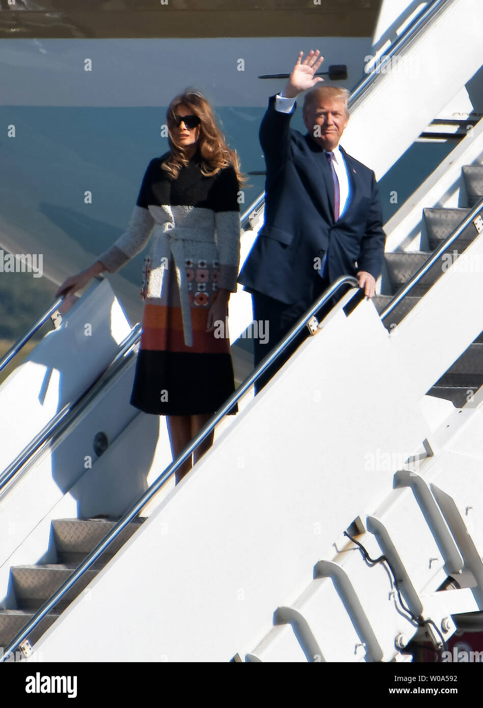 U.S. President Donald Trump and his wife Melania wave to participant at ...