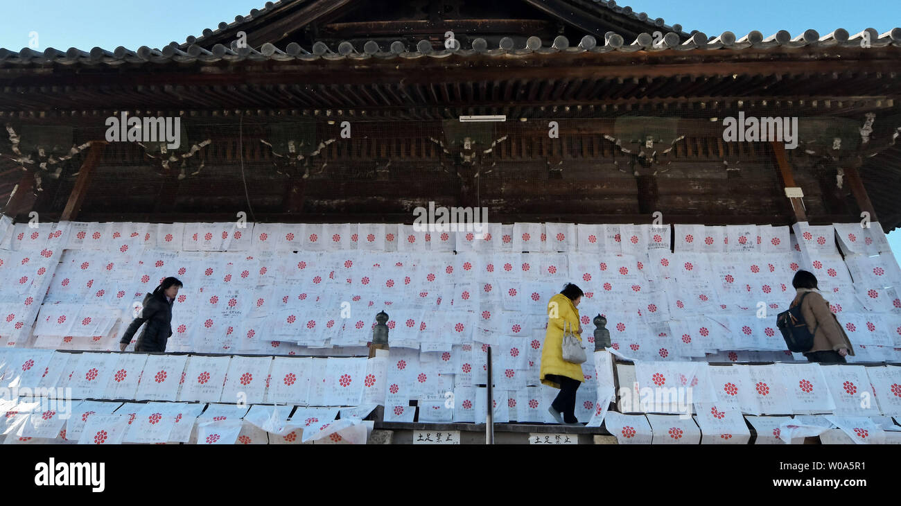 Women walk a hundred times offering a prayer around main hall of a ...