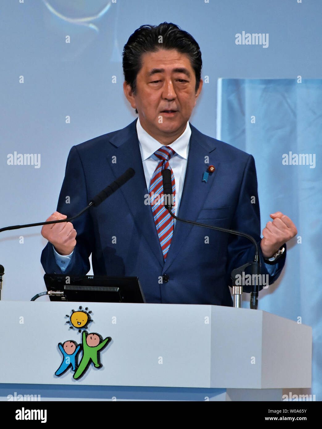 Japan's Prime Minister Shinzo Abe delivers a speech during the annual ...