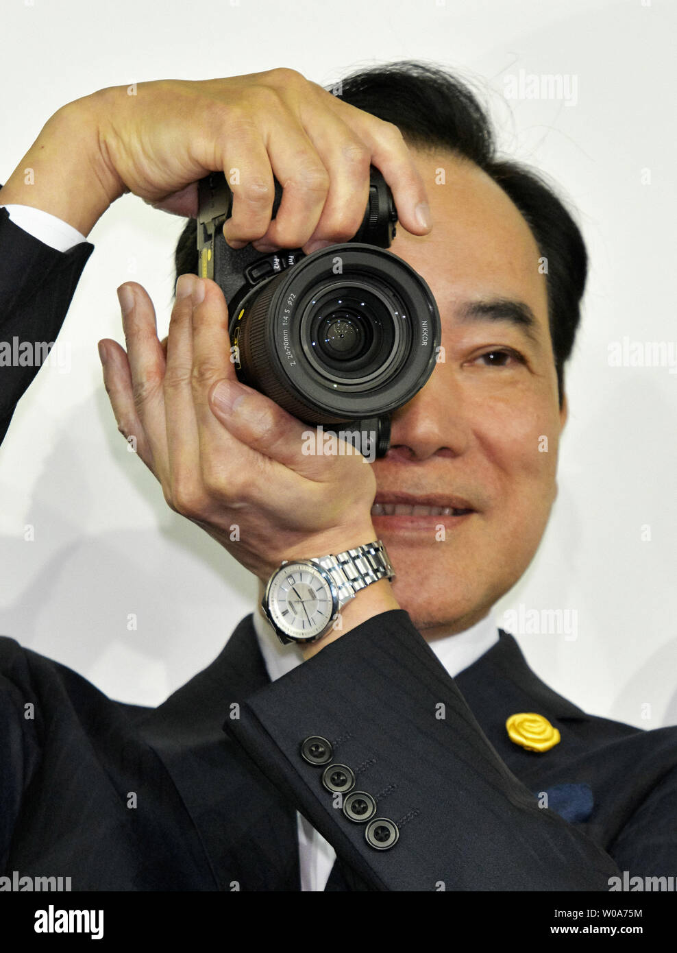 President of NIKON CORPORATION, Kazuo Ushida poses for camera during an ...
