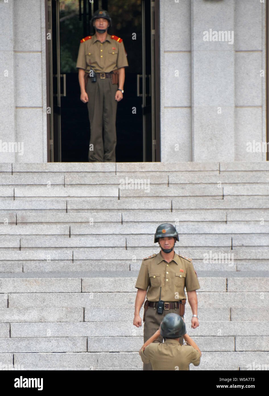 North Korean soldiers take a photo or a movie at the joint security ...