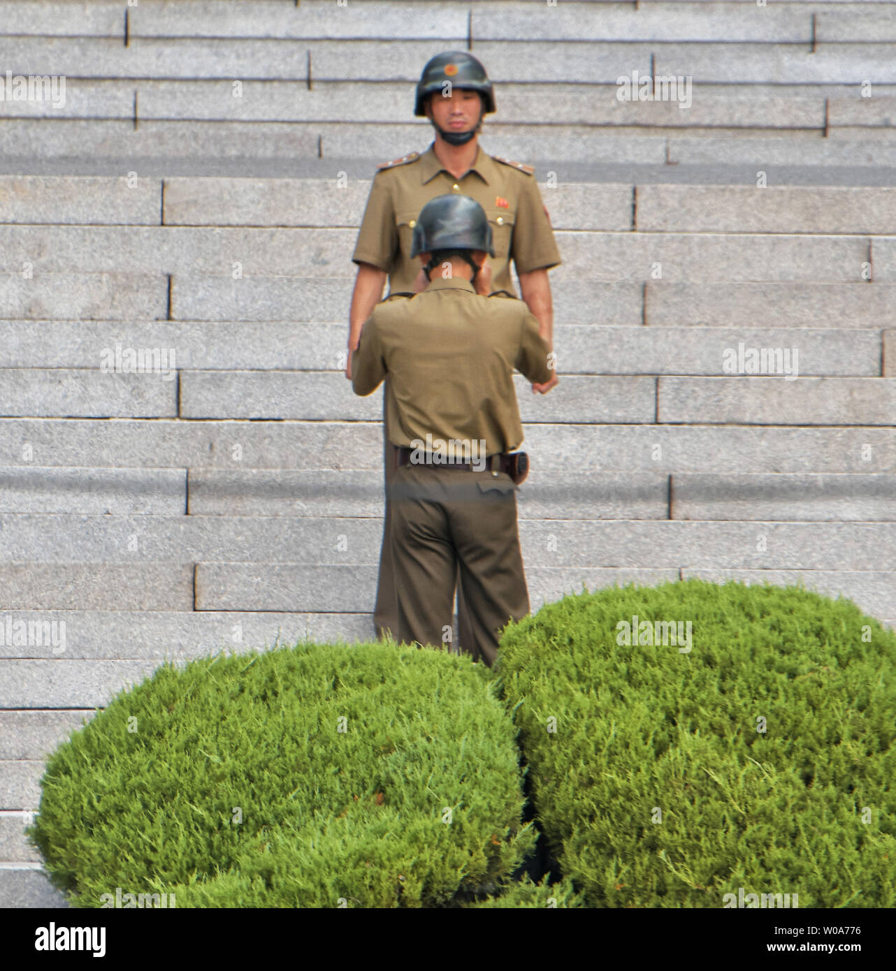 North Korean soldiers take a photo or a movie at the joint security ...