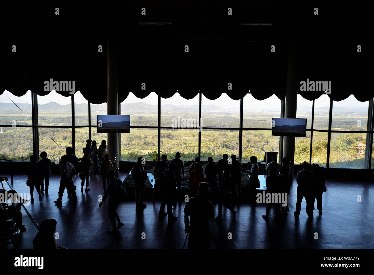 Tourist look into North Korea from the Dora Observatory in the Civilian ...