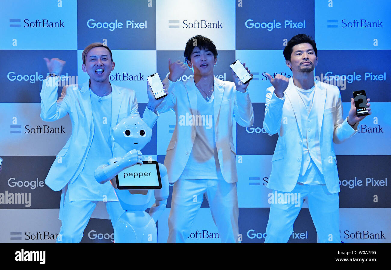 Pepper of Softbank's semi-humanoid robot performs with Japanese boy ...