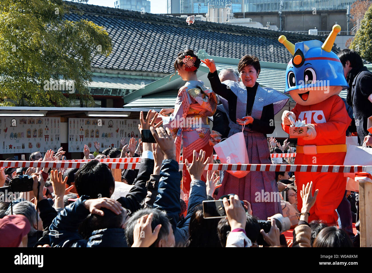 Tokyo Governor Yuriko Koike(R2) throws beans during the bean-throwing ...