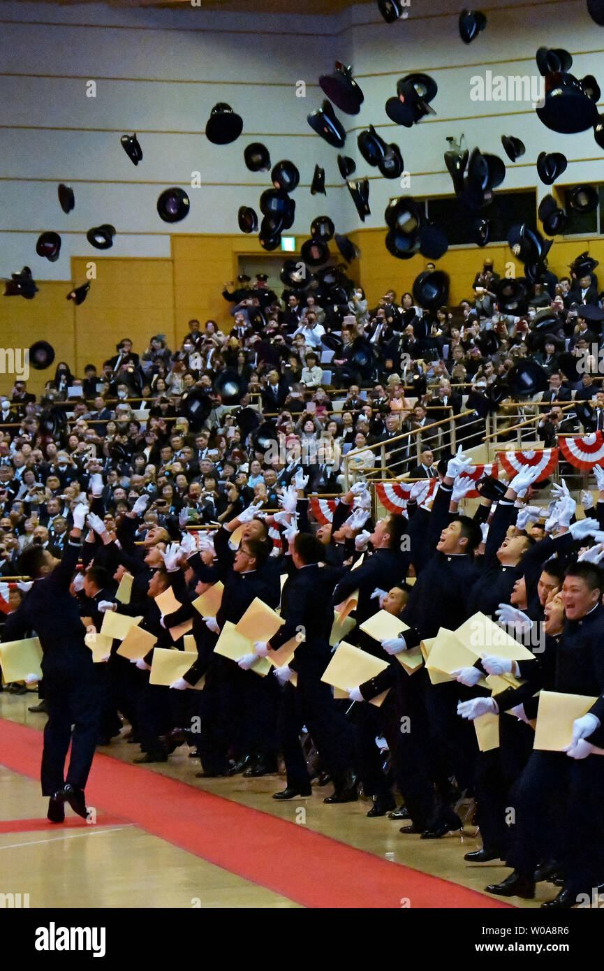 Graduates of Japan's National Defense Academy leave after the ...