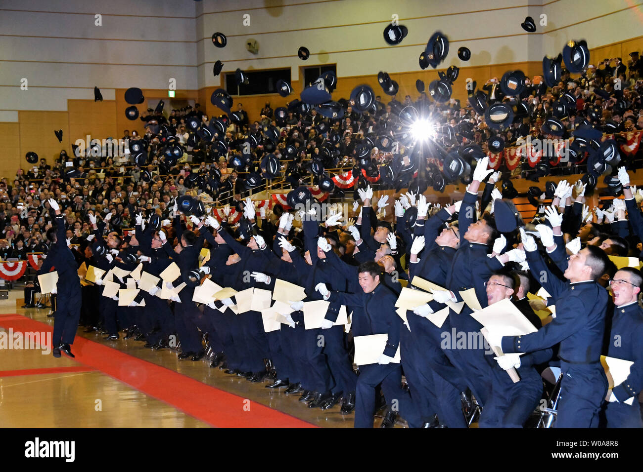 Graduates of Japan's National Defense Academy leave after the ...