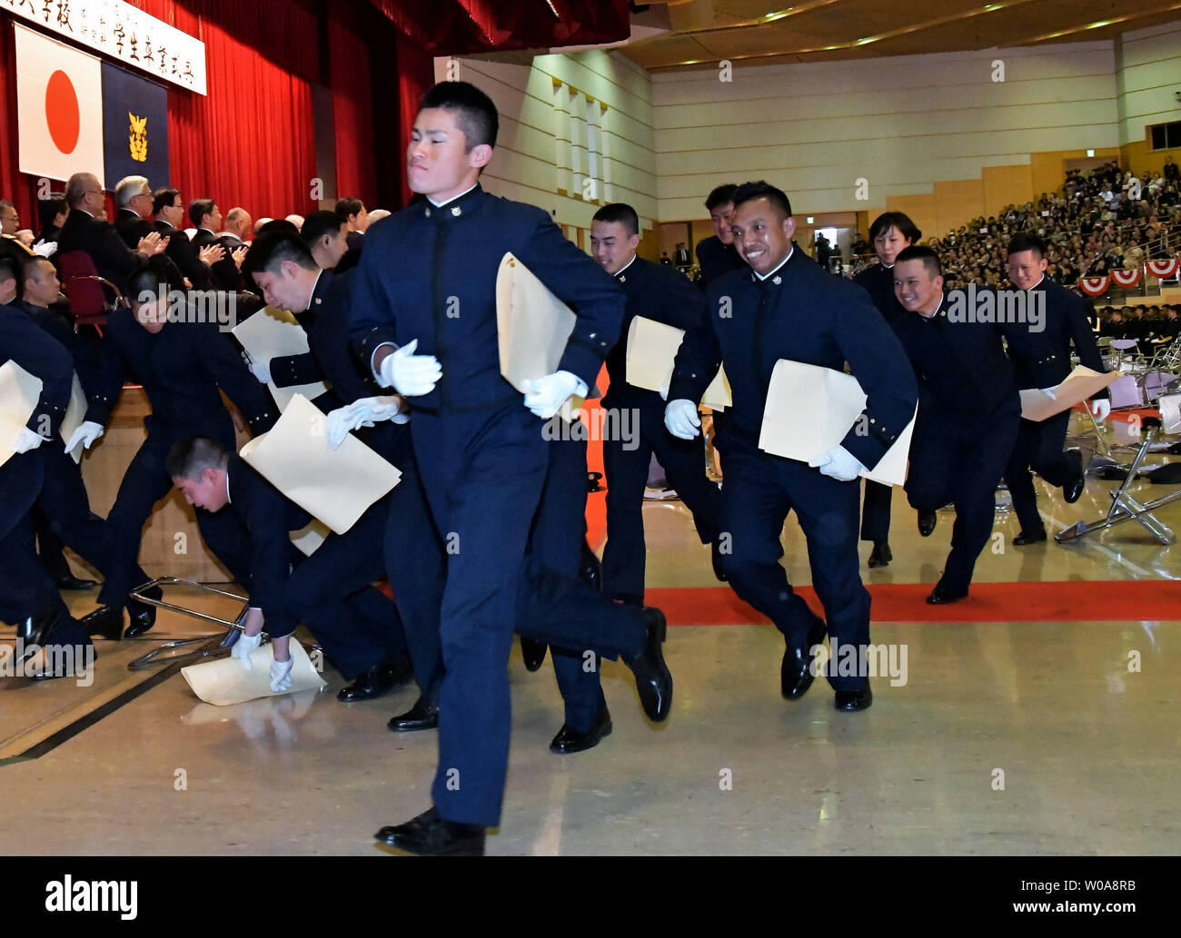 Graduates of Japan's National Defense Academy leave after the ...