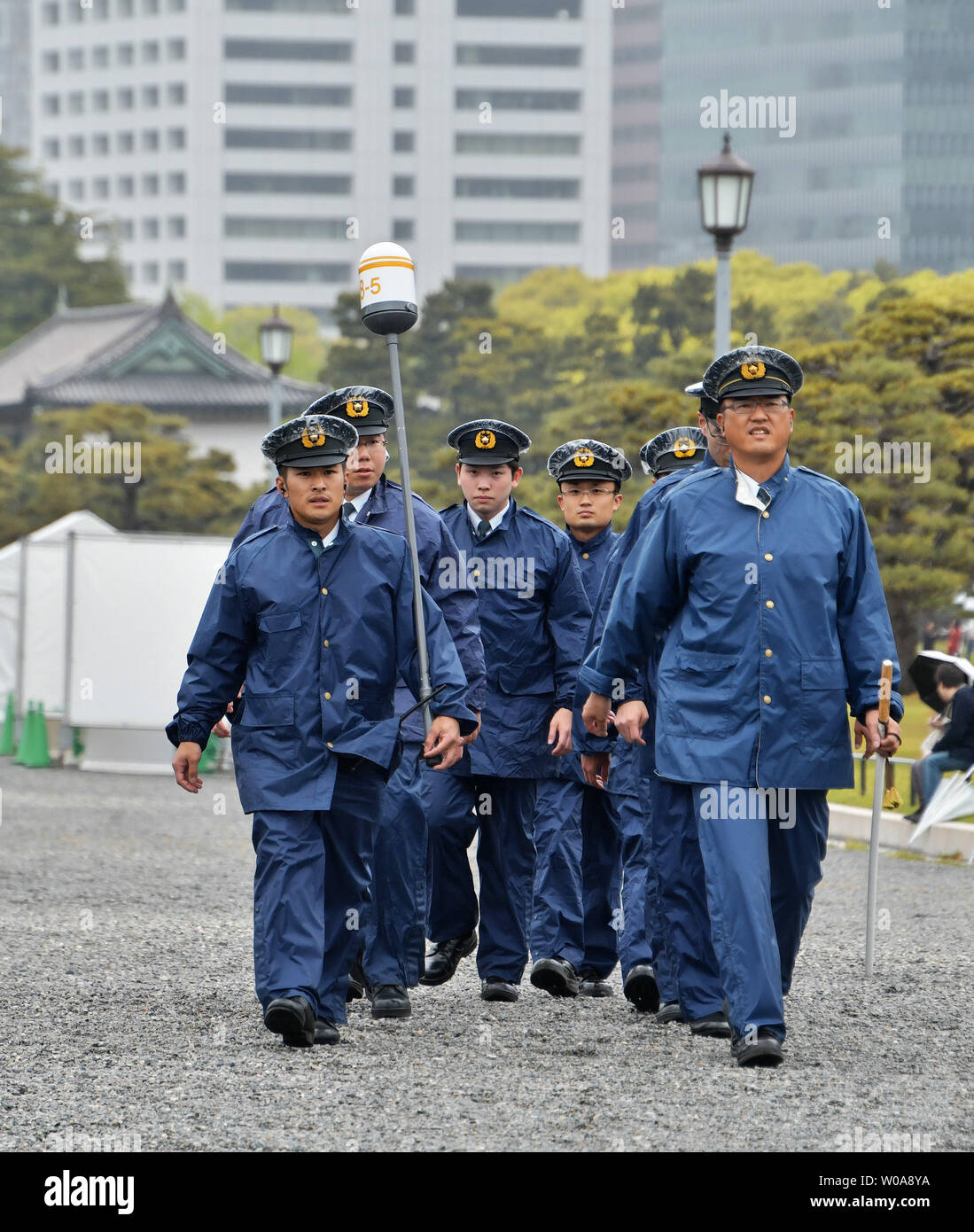 Member of Tokyo metropolitan police officer stand guard around the ...