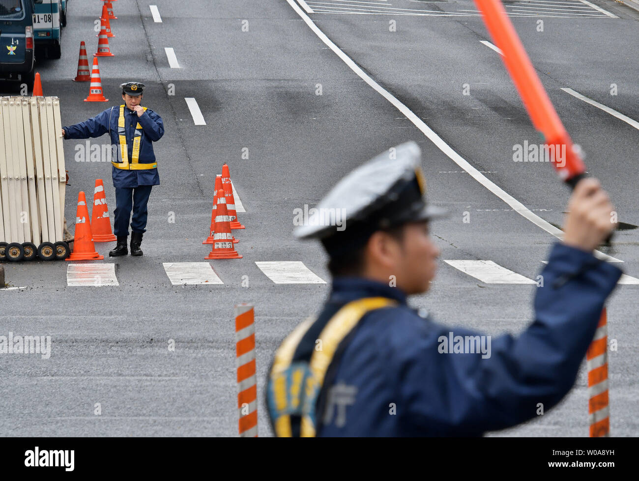 Member of Tokyo metropolitan police officer stand guard around the ...