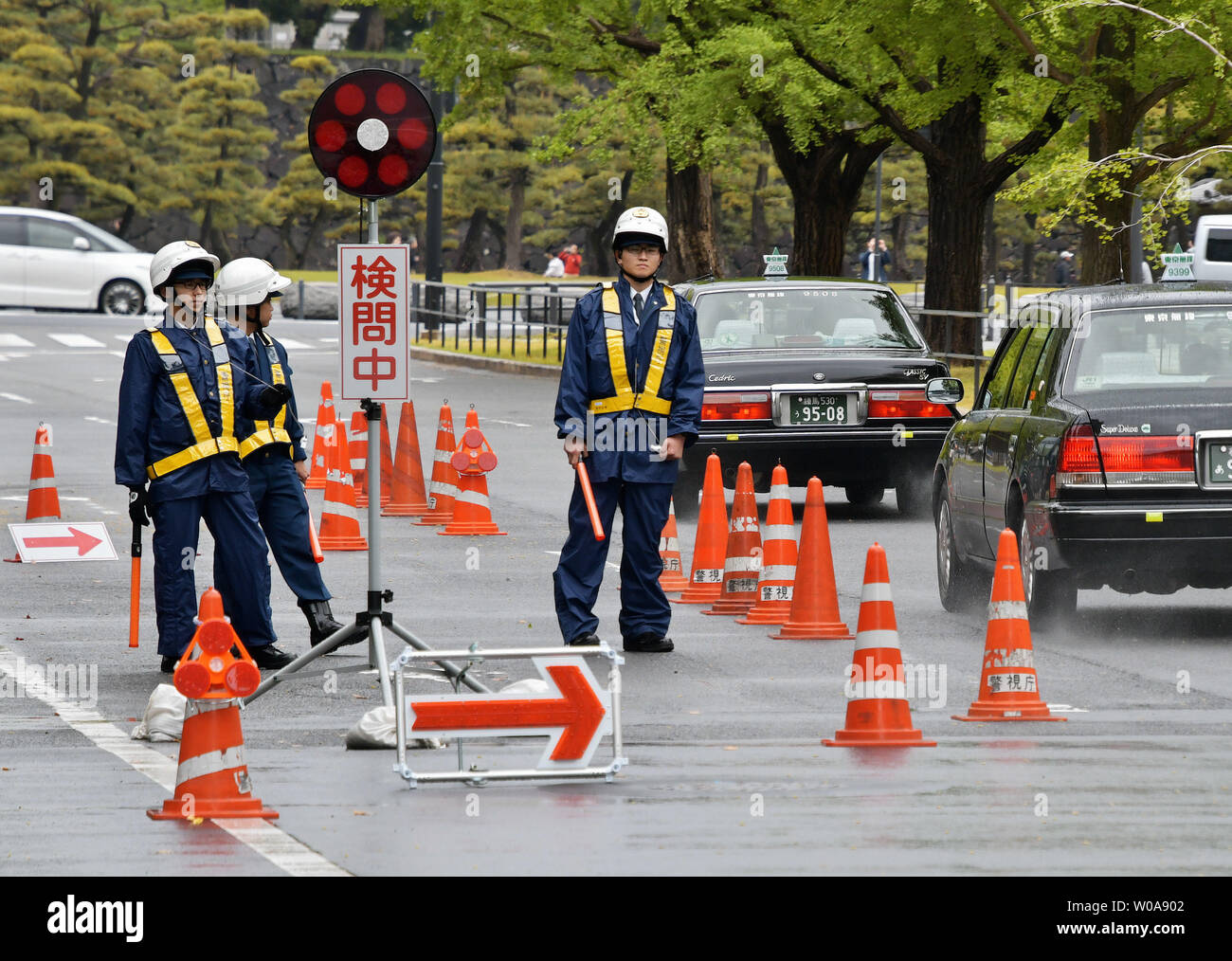Member of Tokyo metropolitan police officer stand guard around the ...