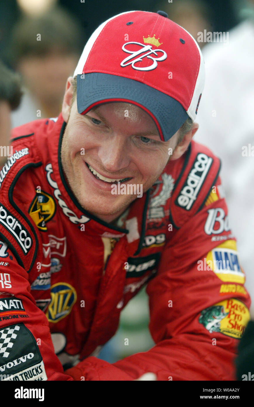 Dale Earnhardt Jr talks with members of his crew before the start of ...