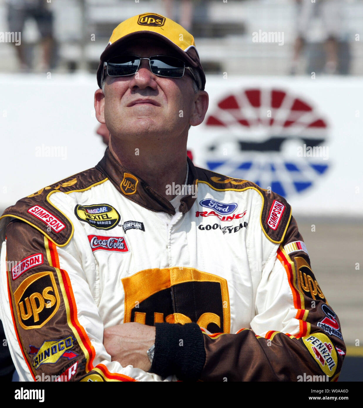 NASCAR race car driver Dale Jarrett watches lap times as he waits on ...