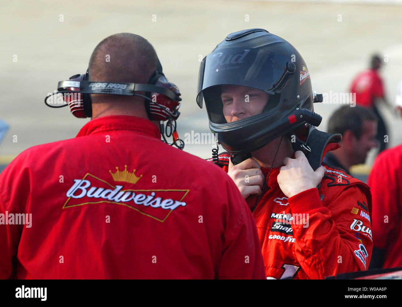 NASCAR race car driver Dale Earnhardt Jr. straps on his helmet before ...