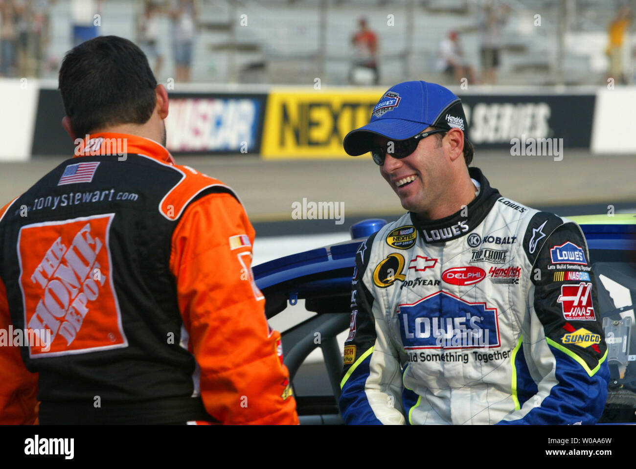 NASCAR race car drivers Jimmie Johnson, right, and Tony Stewart talk on ...
