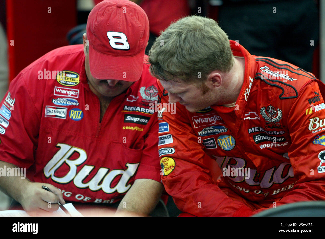 NASCAR race car driver Dale Earnhardt Jr., right, talks with crew chief ...