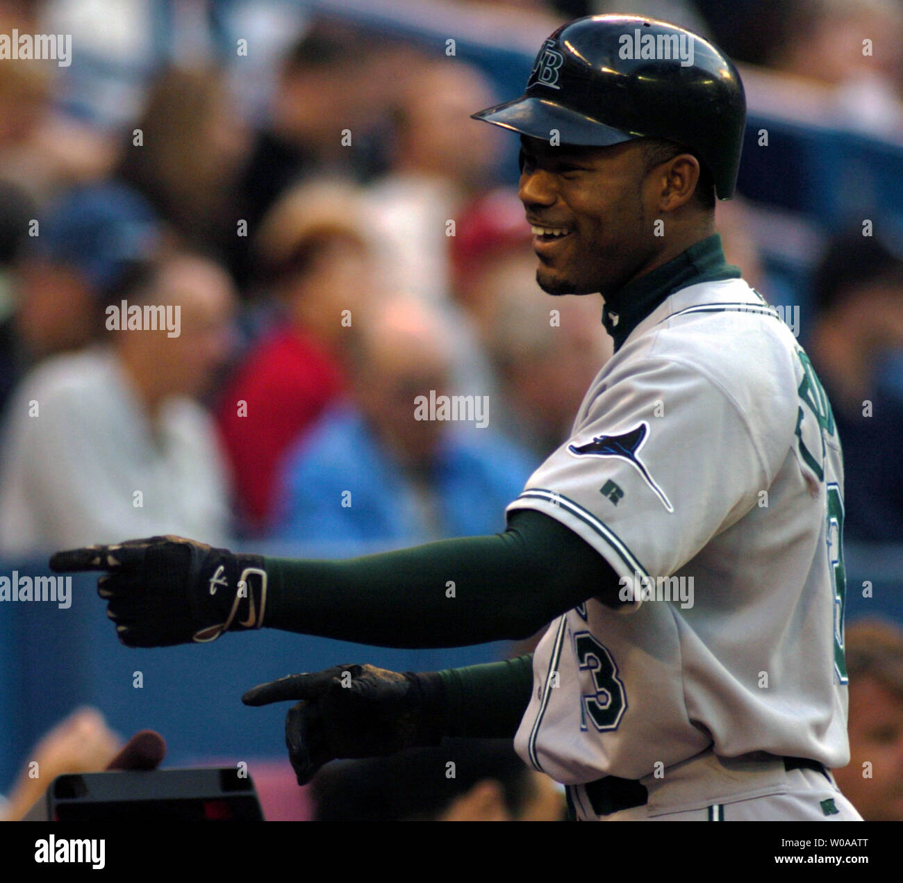 Tampa Bay Devil Rays' Carl Crawford points to his cheering teammates in ...