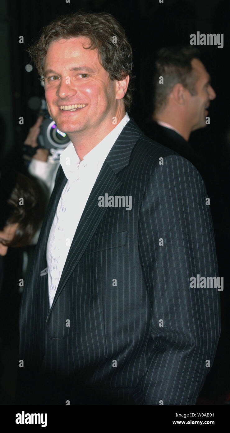 British actor Colin Firth turns to smile at fans calling out to him ...
