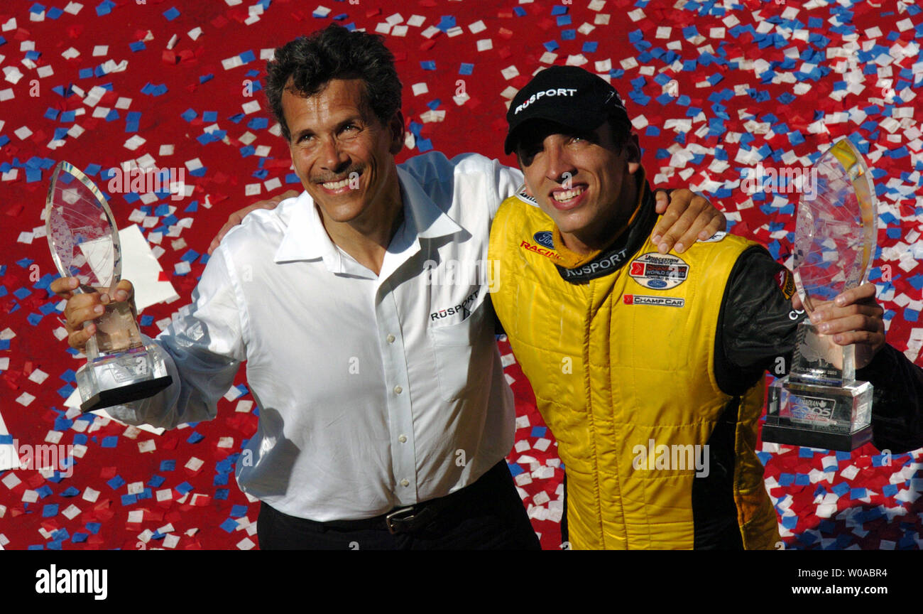 Justin Wilson(right) and RuSport team owner Carl Russo hold their ...