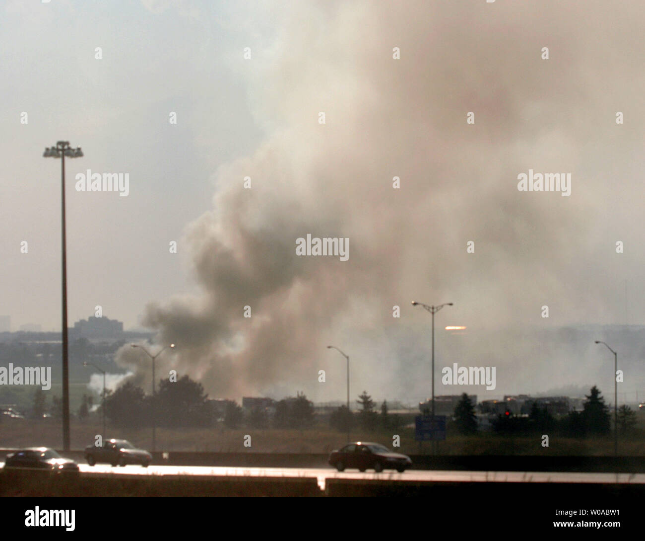 Smoke billows from the wreckage of Air France flight 358 after it ...