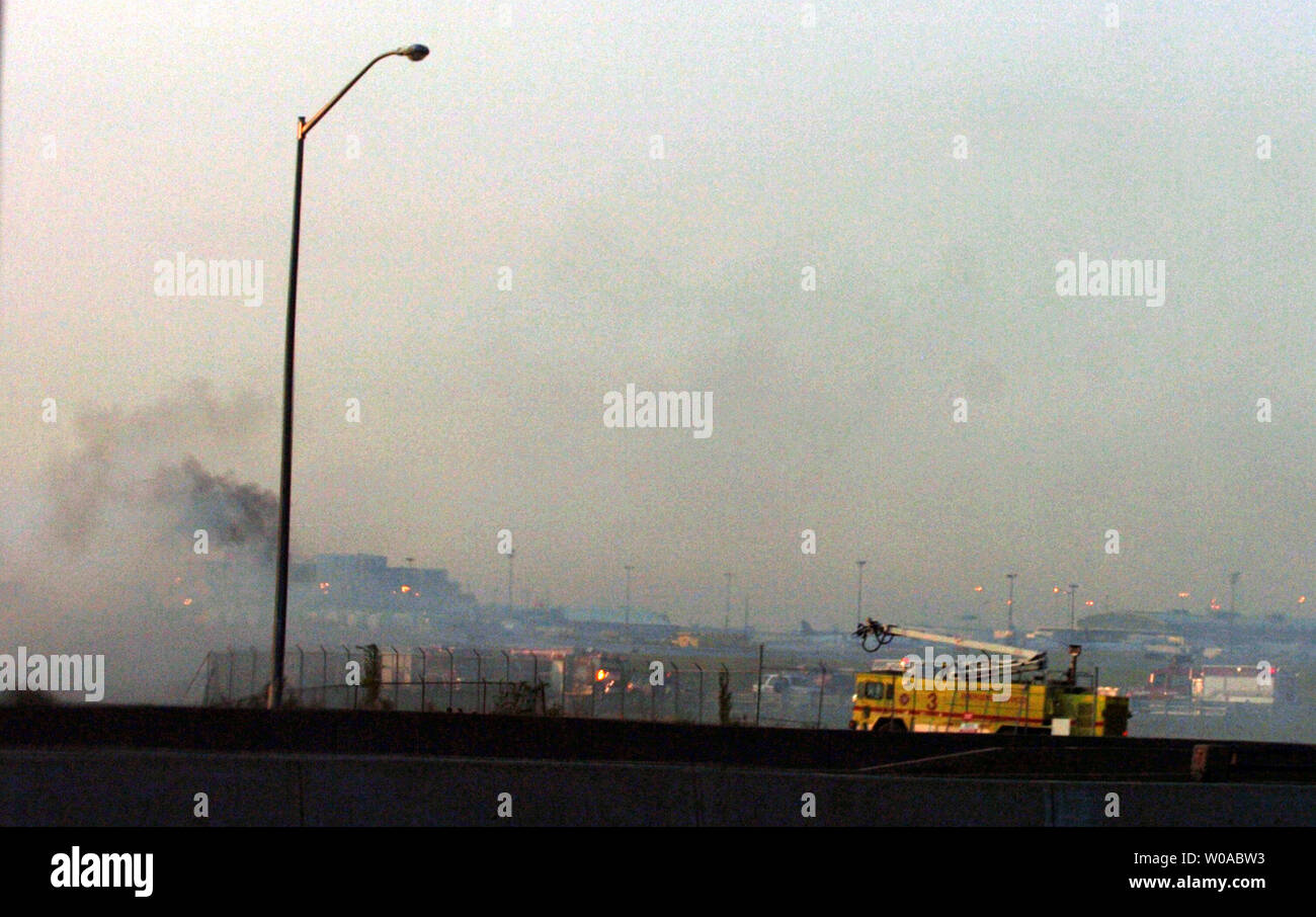 Emergency crews work to put out the fires near the wreckage of Air ...