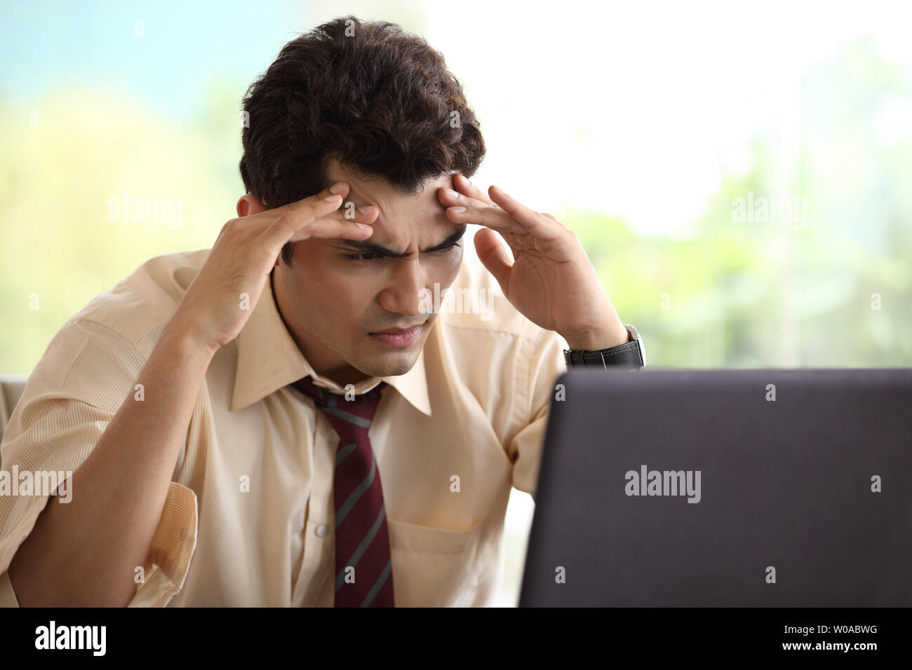 Indian businessman looking stressed Stock Photo - Alamy