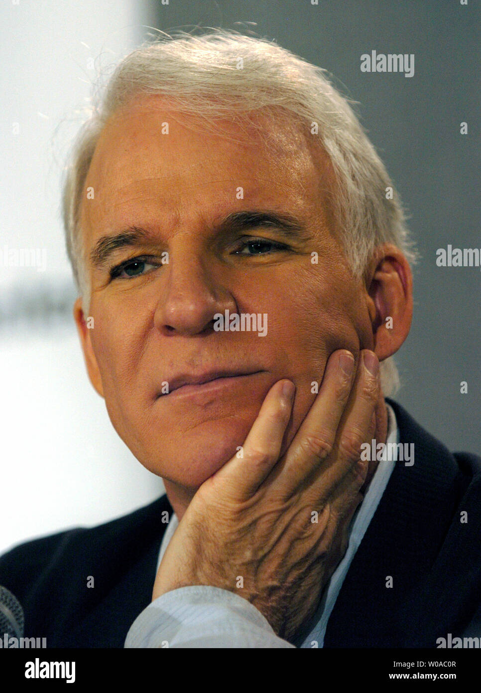 Steve Martin listens to questions from the media at a press conference ...