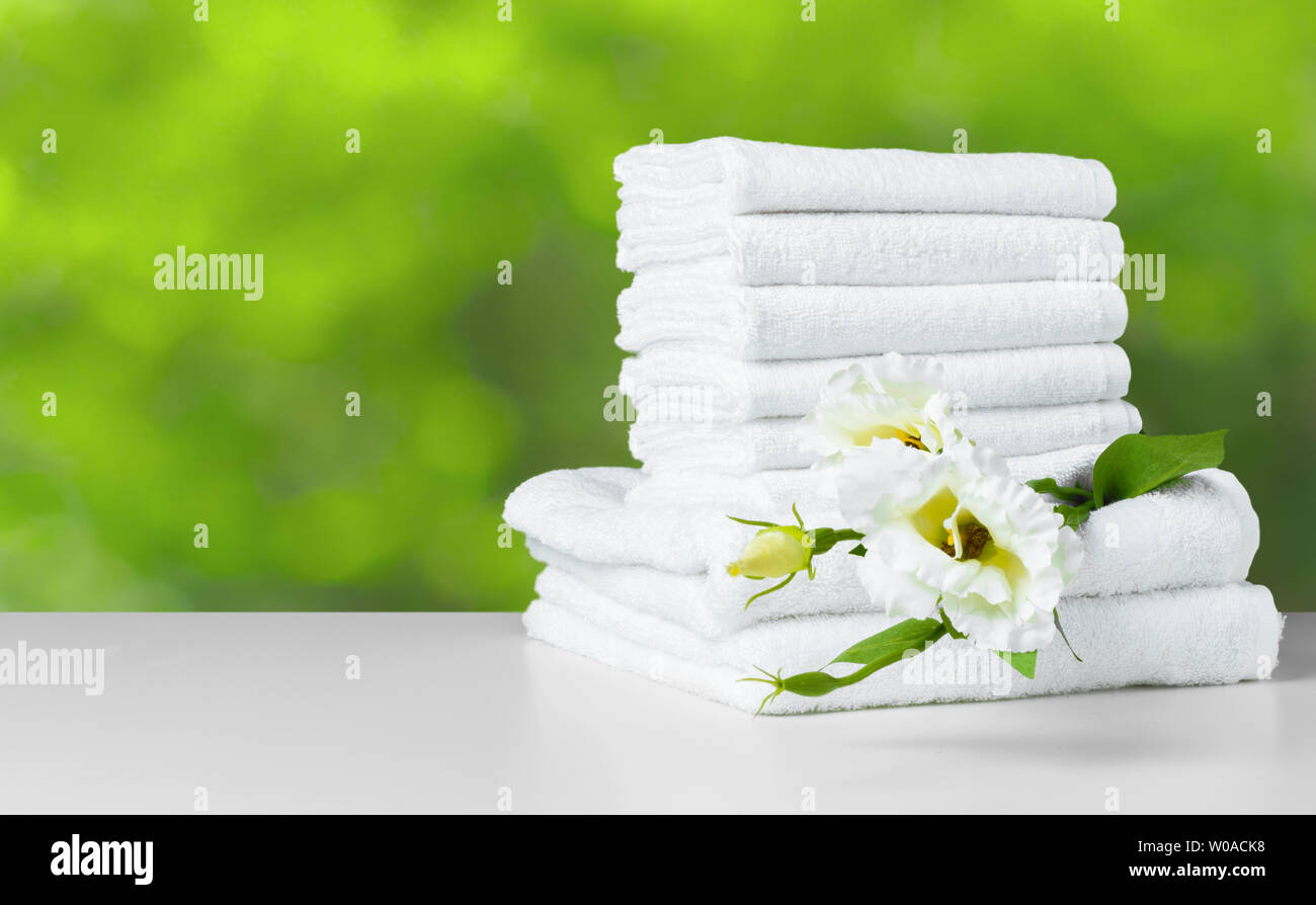 Stack of folded white spa towels Stock Photo - Alamy