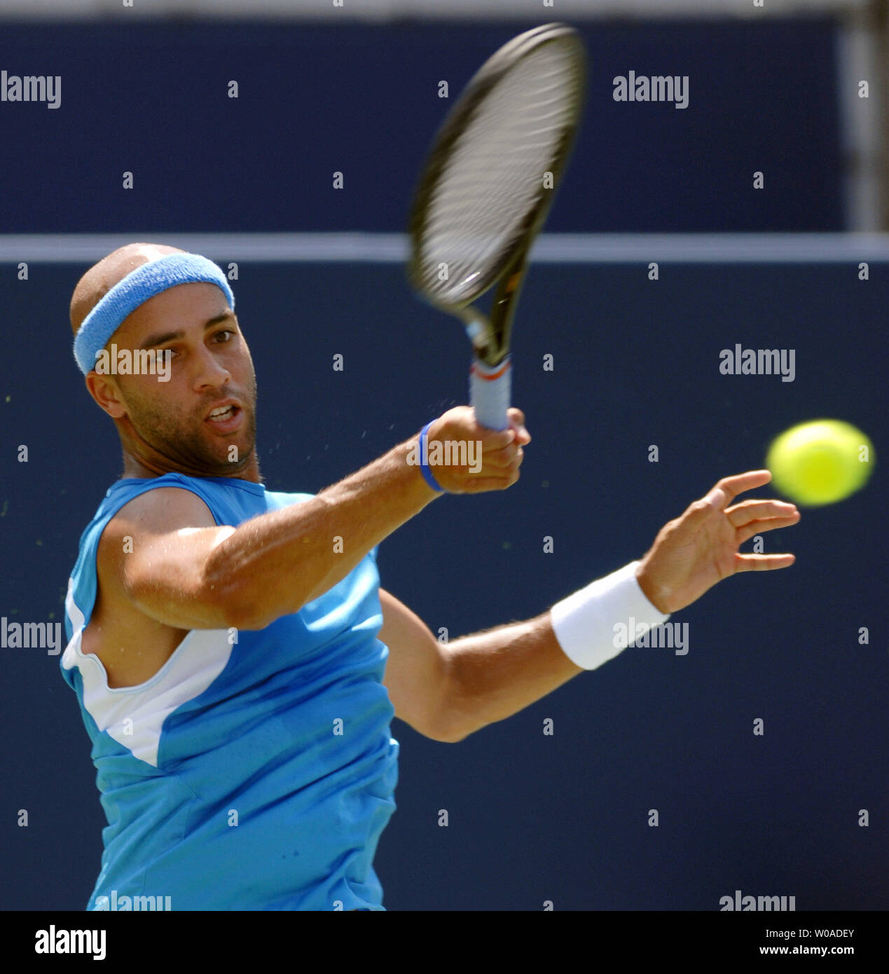 James Blake hits a forehand return to opponent Richard Gasquet during ...
