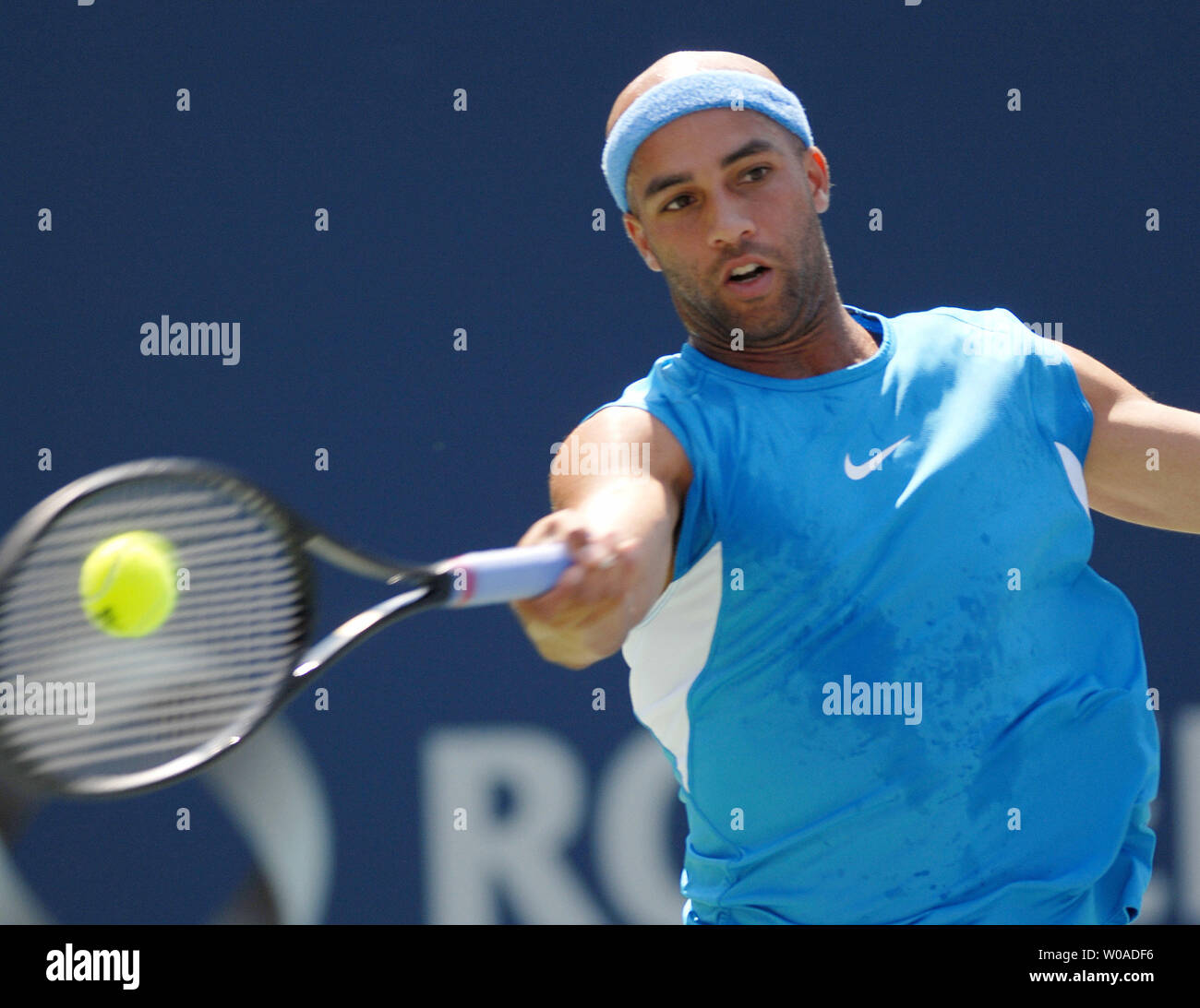 James Blake hits a forehand return to opponent Richard Gasquet during ...