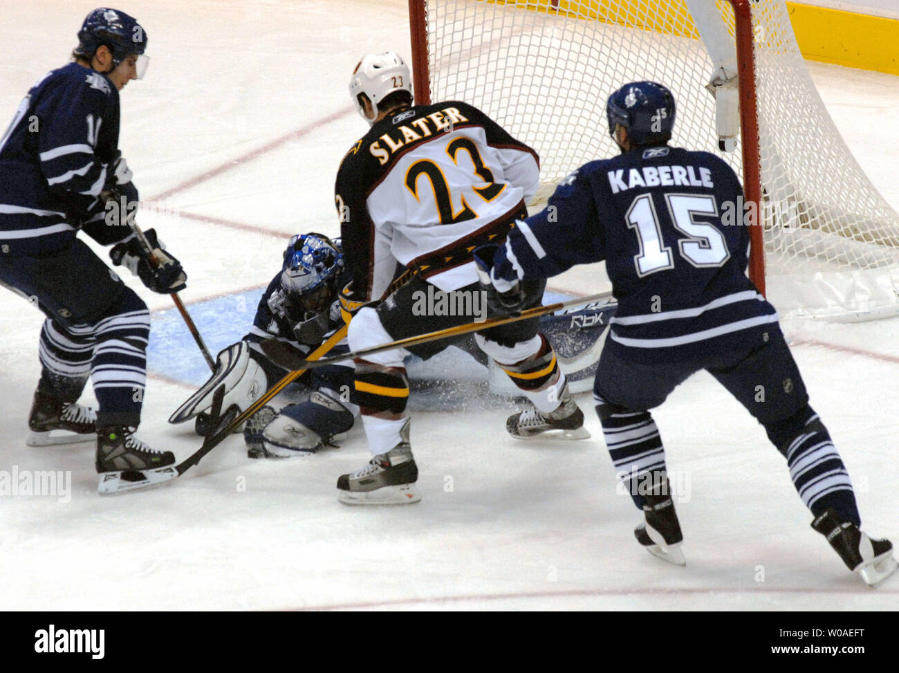 Toronto Maple Leafs' goalie Andrew Raycroft falls on the puck as ...