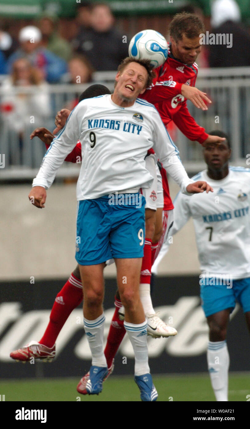 Kansas City Wizards' Sasha Victorine (L) and Toronto FC's Kevin ...