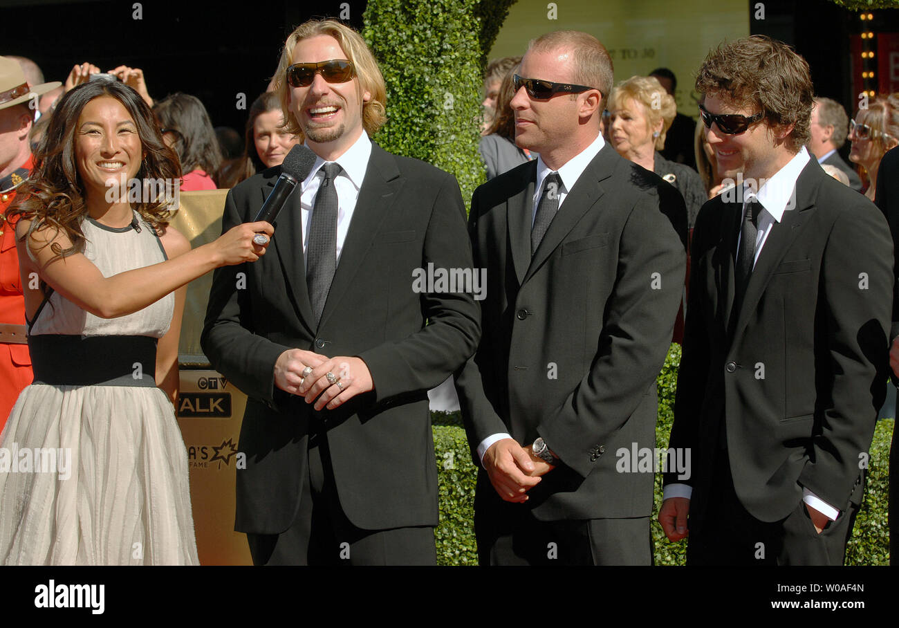 (L-R)Television host Tanya Kim interviews Nickelback members Chad ...