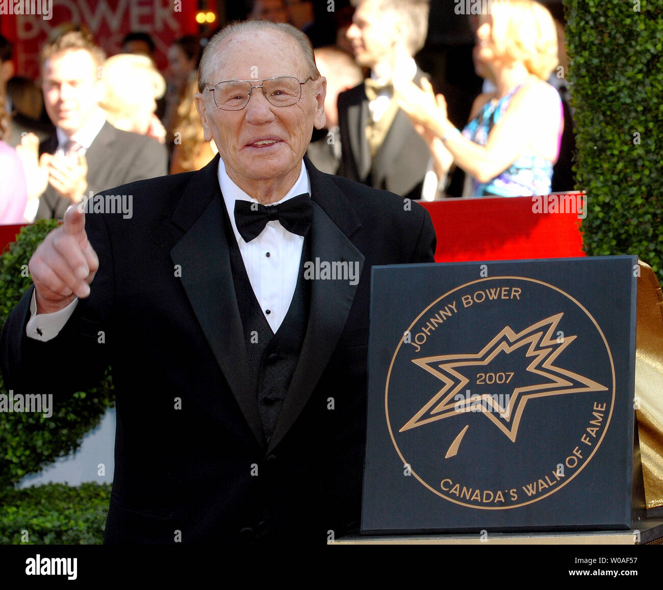 Hockey Hall of Famer Johnny Bower shows off his newly unveiled star as ...