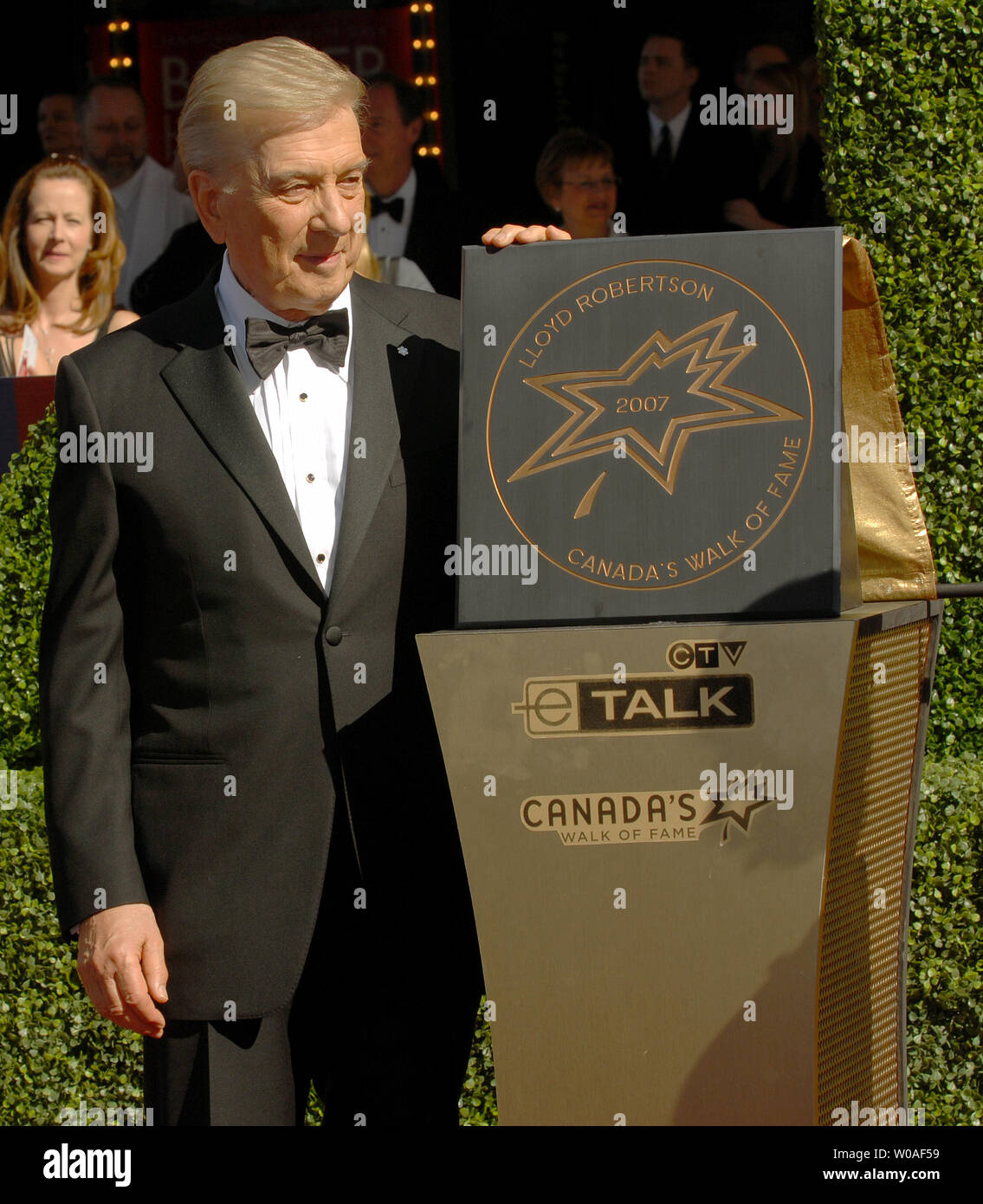 Television news anchor Lloyd Robertson shows off his newly unveiled ...