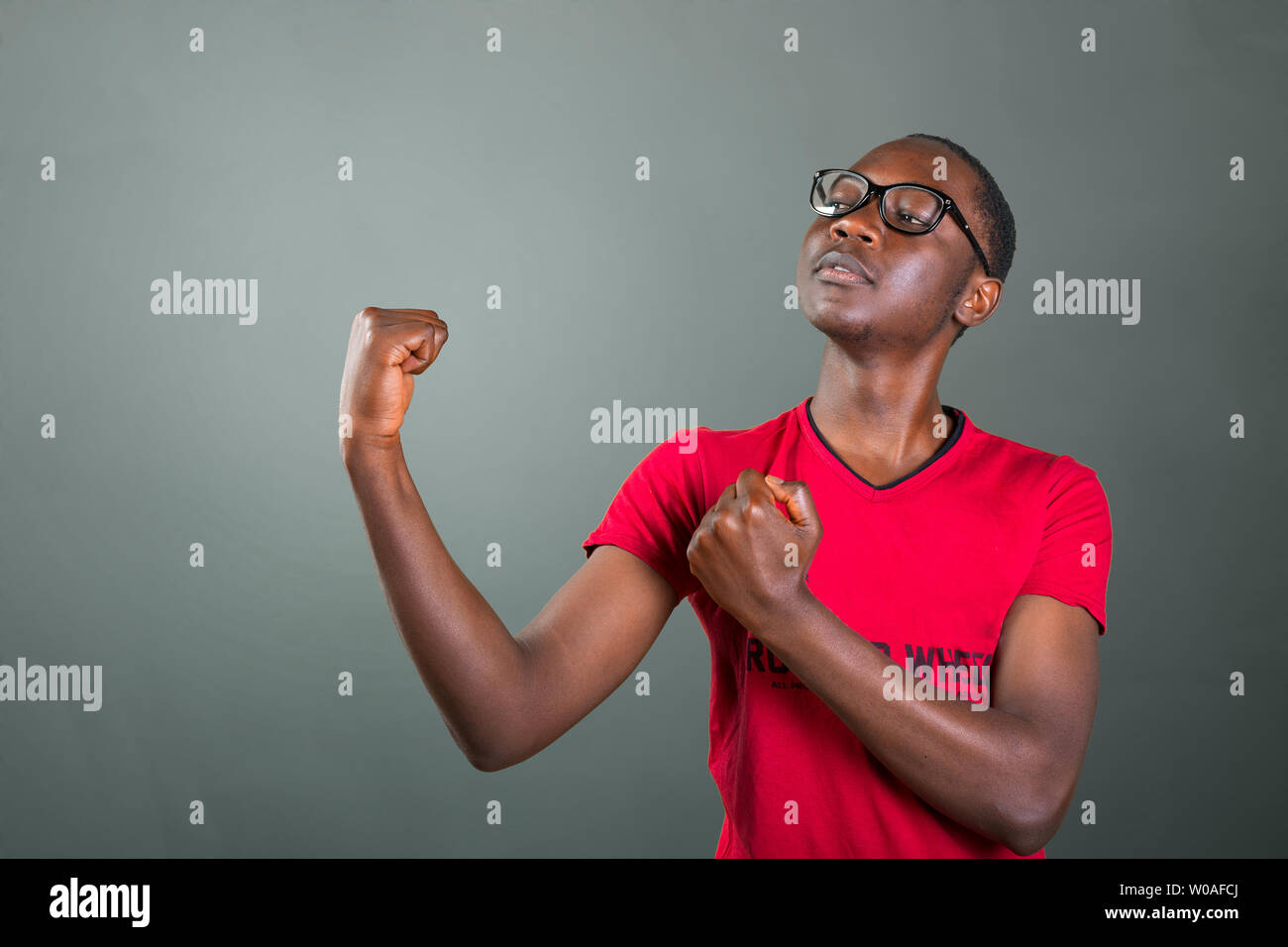 Handsome young african american man, showing off his physique in an ...