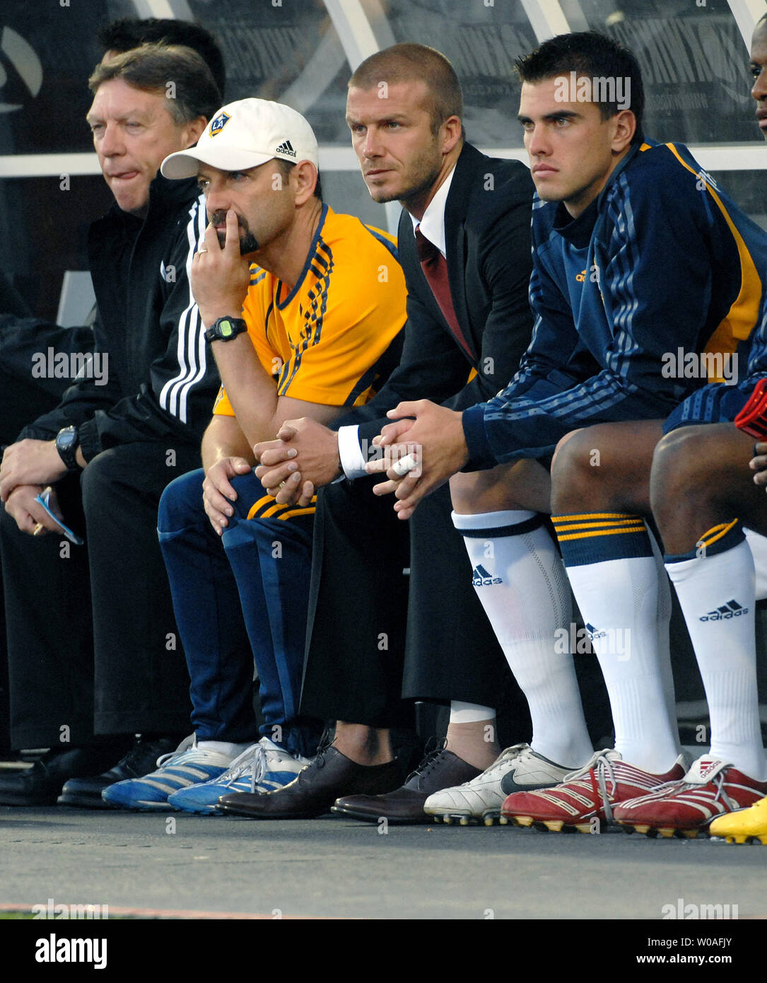 Sidelined by an ankle injury, L.A. Galaxy star David Beckham (third ...