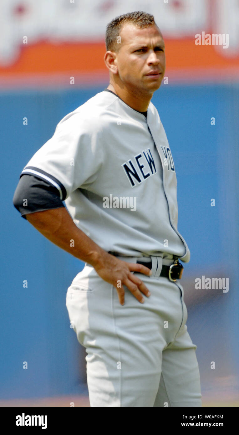 New York Yankees' Alex Rodriguez waits for a teammate to bring him his ...