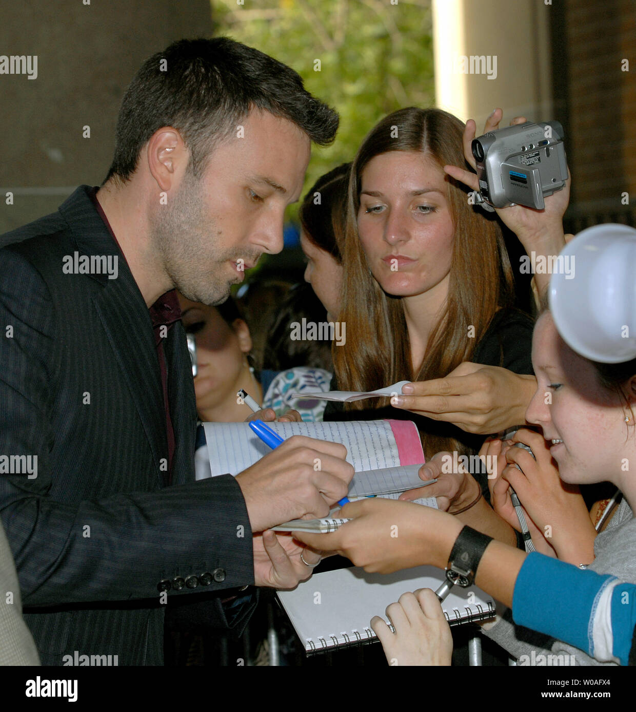 Ben Affleck signs autographs for fans as he arrives at the Ryerson ...