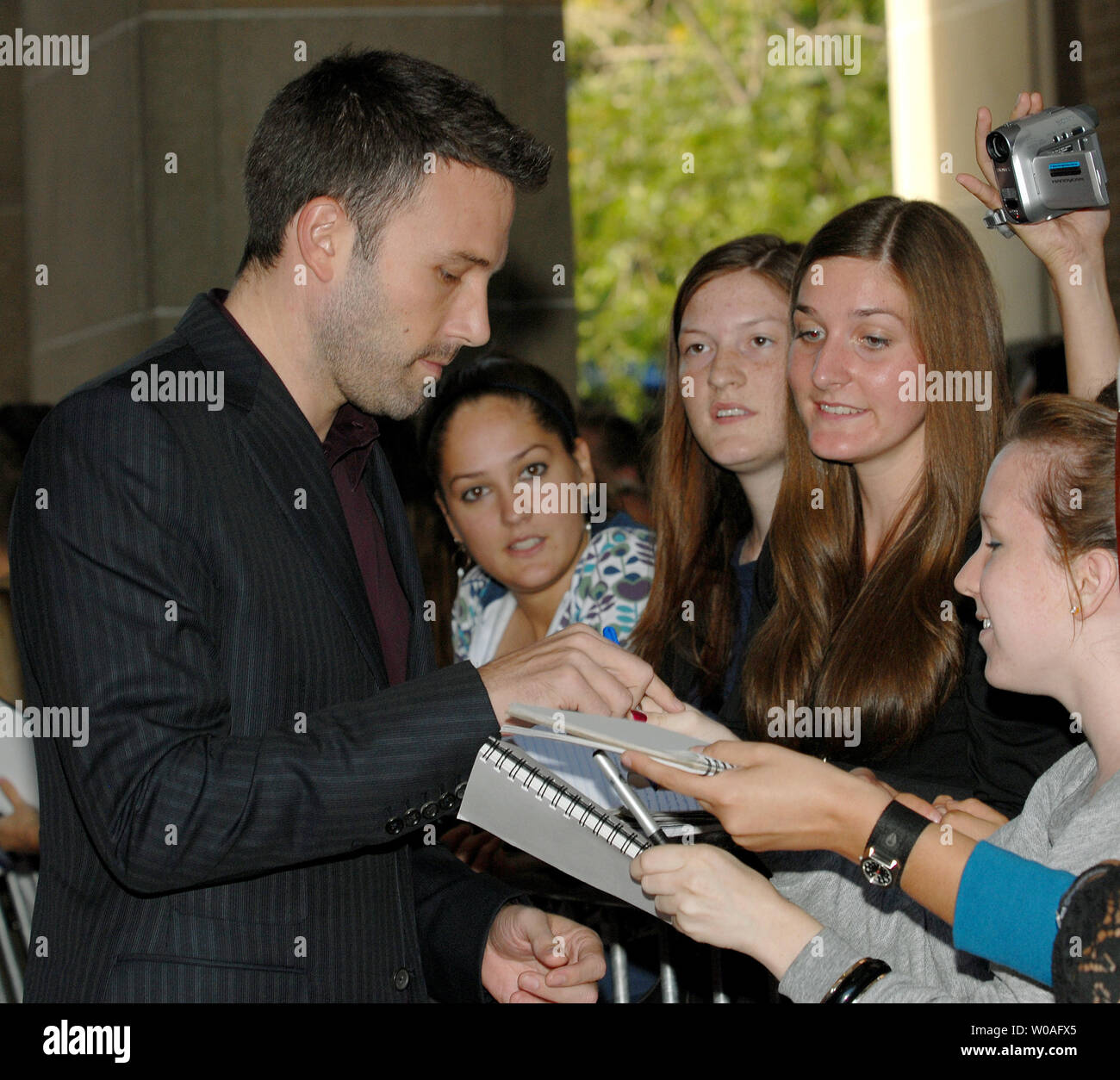 Ben Affleck signs autographs for fans as he arrives at the Ryerson ...