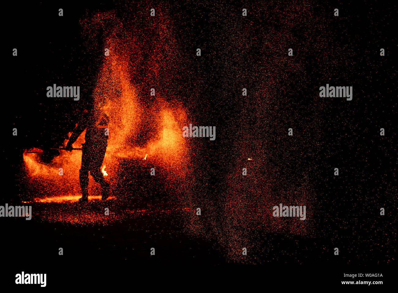 Fire show, dancing with flame, male master juggling with fireworks ...