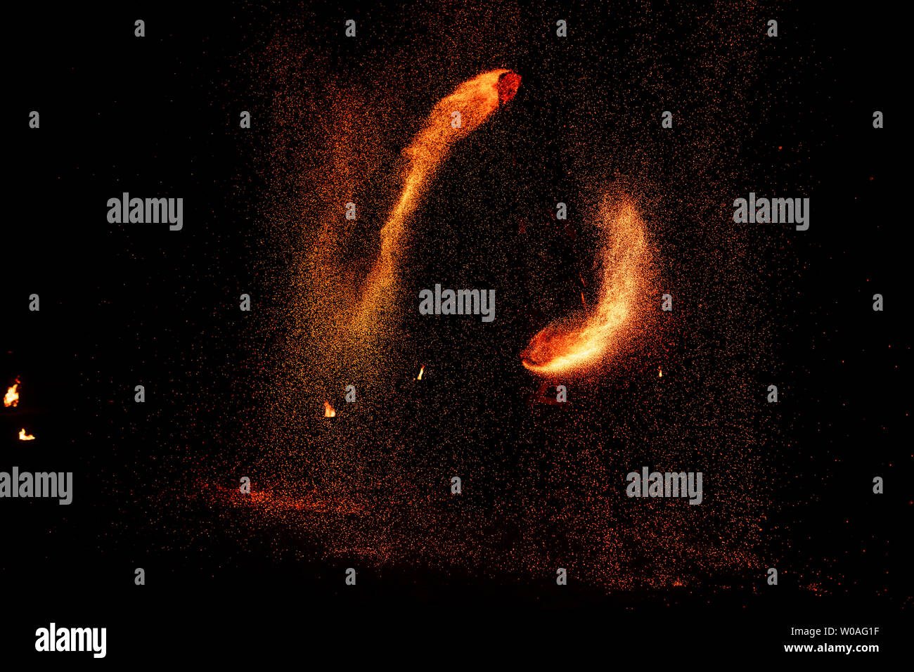 Fire show, dancing with flame, male master juggling with fireworks ...