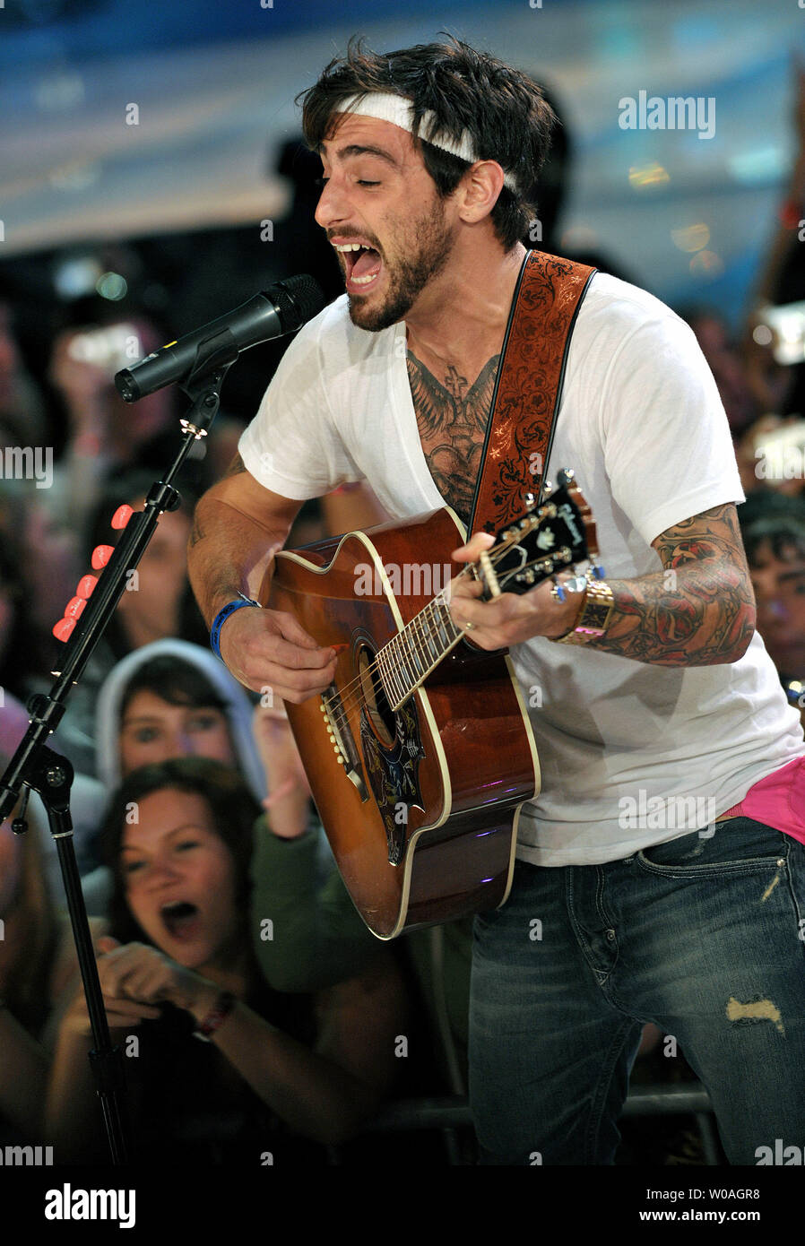 Lead singer Jacob Hoggard of Hedley performs on an outdoor stage before ...