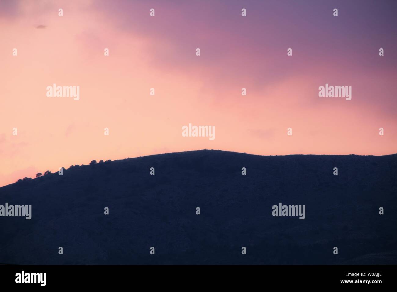 Beautiful purple and pink sky at sunset in Spain Stock Photo - Alamy