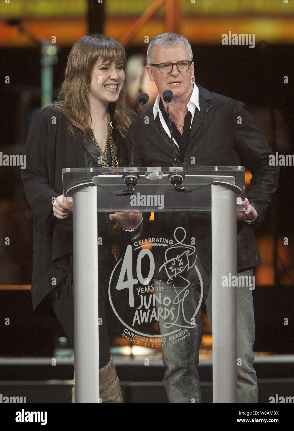 Singers Serena Ryder (L) and Alan Frew help introduce Deane Cameron the ...