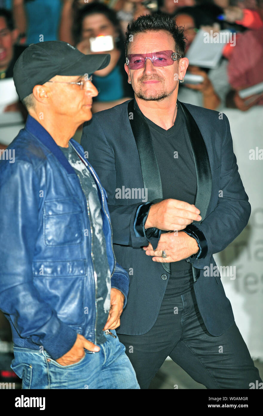 U2's Bono (R) arrives for the world premiere gala screening of 'Ides of ...