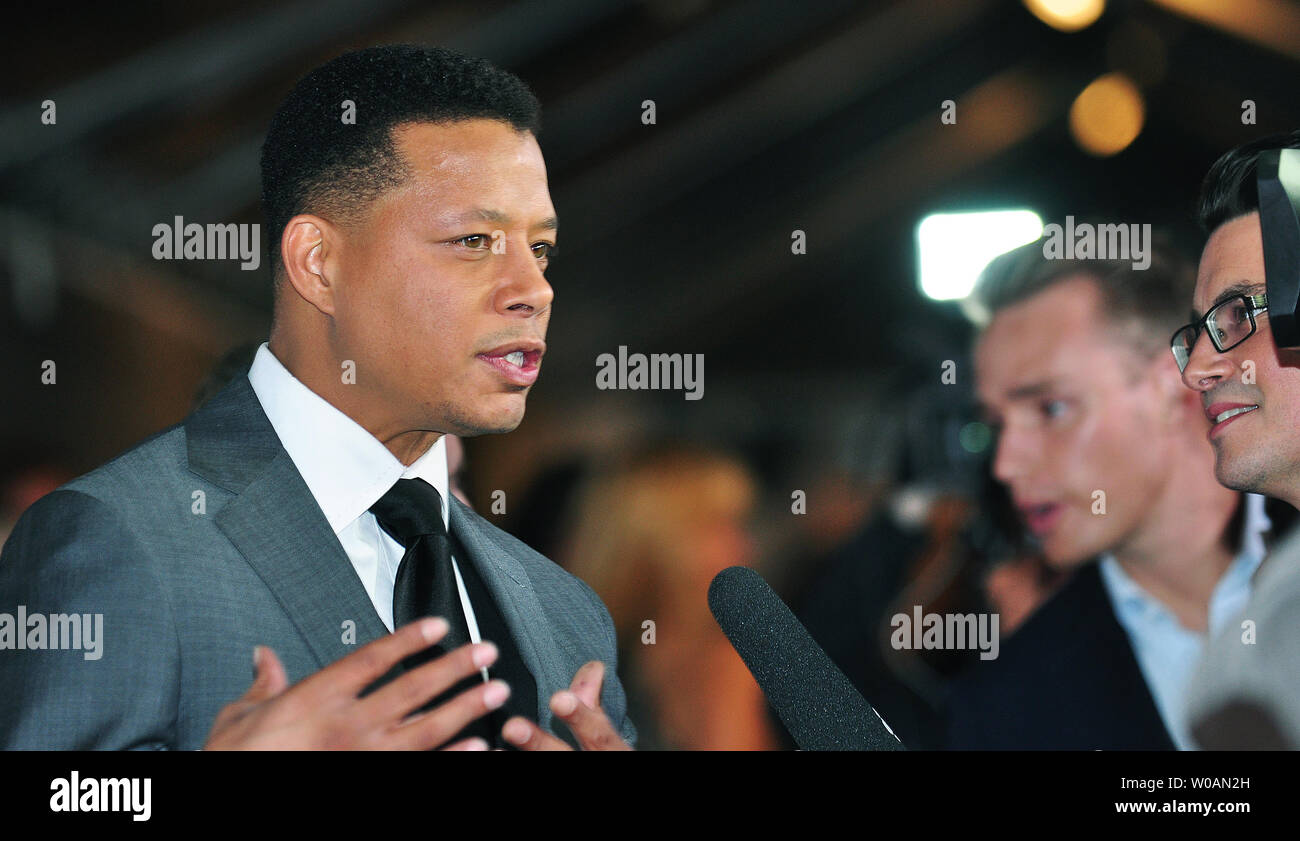 Actor Terrence Howard (L) speaks with television reporters on the red ...