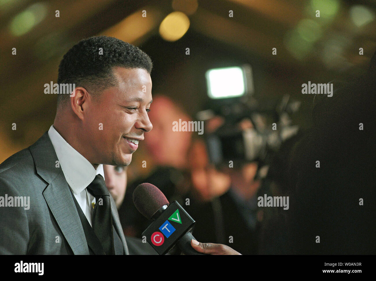 Actor Terrence Howard speaks with television reporters on the red ...